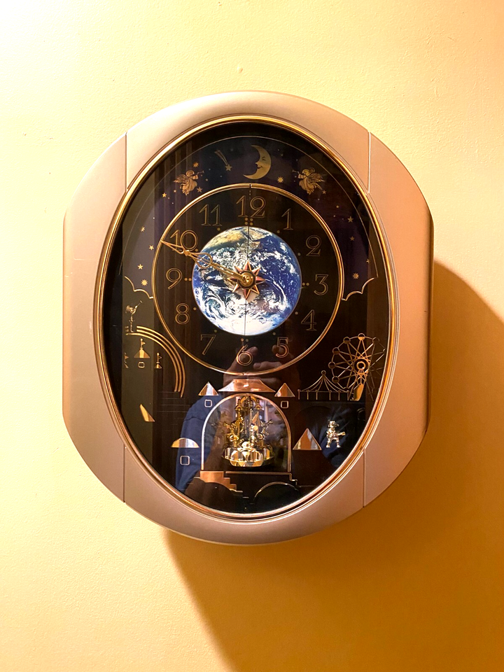 Rhythm Clock "Peaceful Cosmos" Magic Motion Wall Clock | eBay