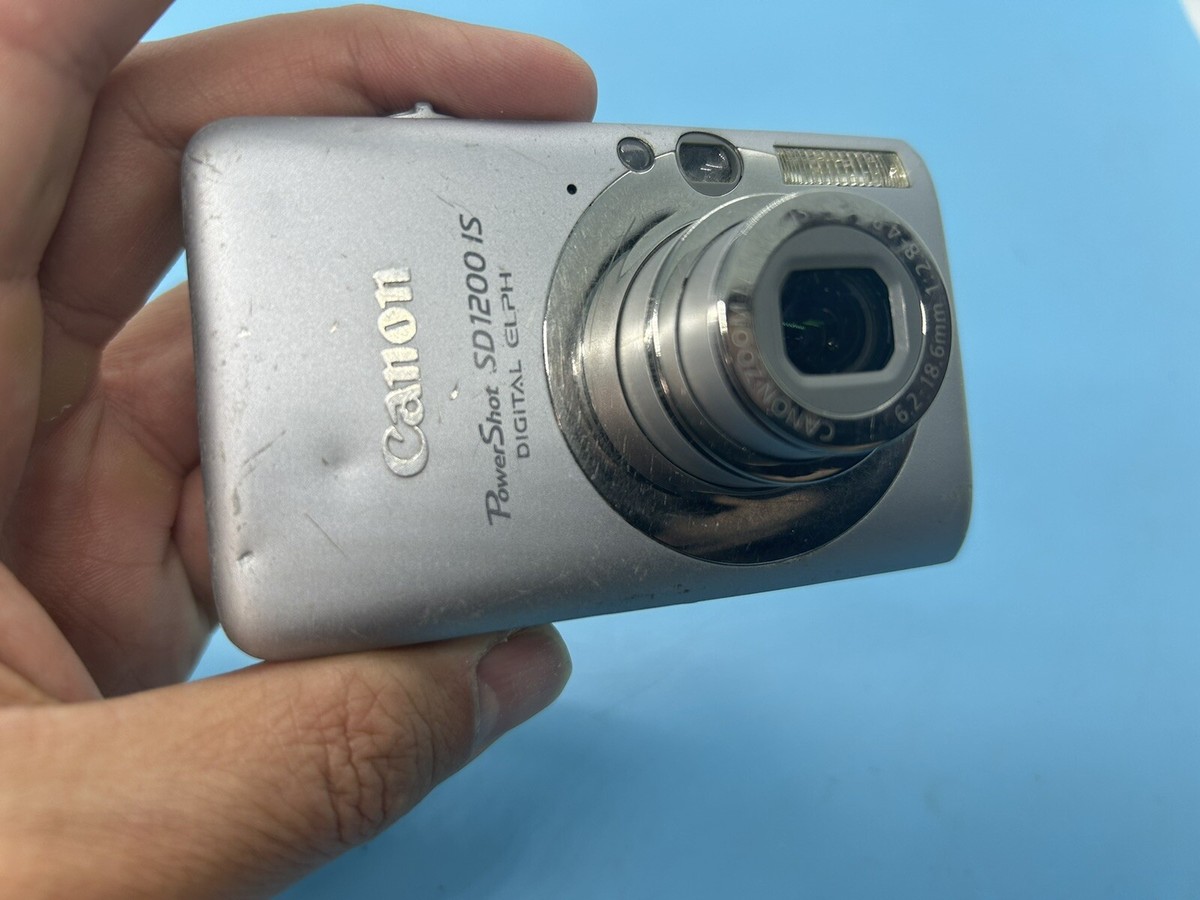 Canon DIGITAL IXUS 95 IS PC1355 10MP Digital Camera. Powers Canon DIGITAL IXUS 95 IS PC1355 10MP Digital Camera. Powers
