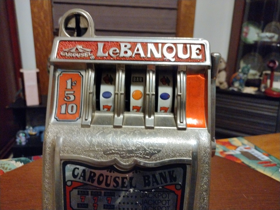 Vintage LeBanque One Arm Banker Toy Slot Machine Coin Carousel Bank | eBay