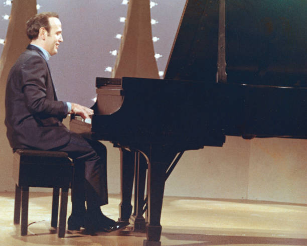 Roger Williams US pianist playing the piano during a live concert- Old ...
