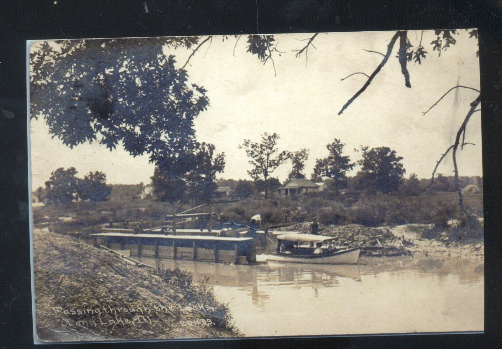 REAL PHOTO LONG LAKE ILLINOIS BOAT PASSING THRU THE DOCKS POSTCARD COPY ...