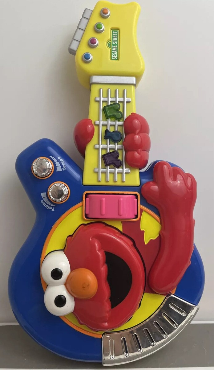 Elmo Mini Guitar Buy Tyco Rock N' Roll Elmo With Guitar And Leather
