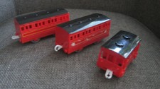 TrackMaster Express Coaches include two red coaches and red brakevan ...
