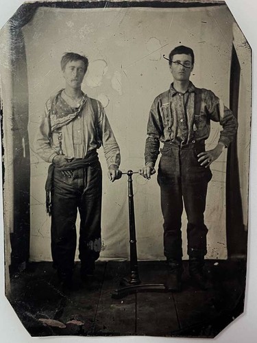Occupation tintype of 2 Young Men Laborers Tradesmen holding onto a ...