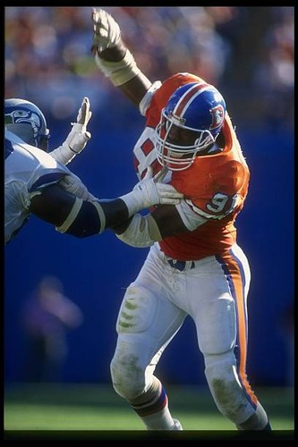 Defensive lineman Warren Powers Denver Broncos works against a Sea- Old ...