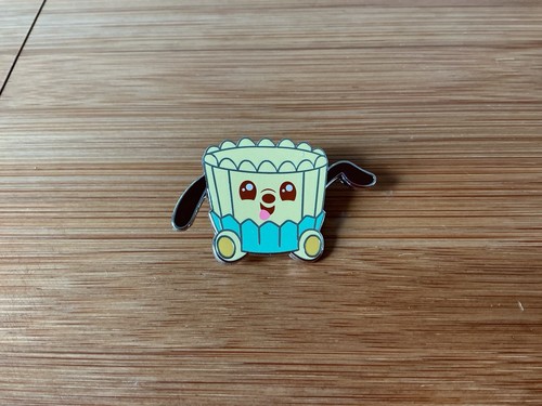 Pluto Munchling Disney Pin Peanut Butter Chocolate Swirl Cup | eBay