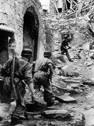 Three Enemy Army soldiers take positions street among ruins town C ...