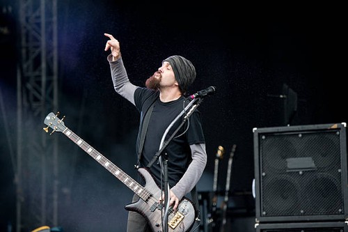 Bassist Robbie Merrill of hard rock group Godsmack performing live- Old ...
