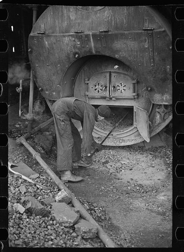 Stoking furnace at gopher hole Williamson County Illinois 1930s Old ...